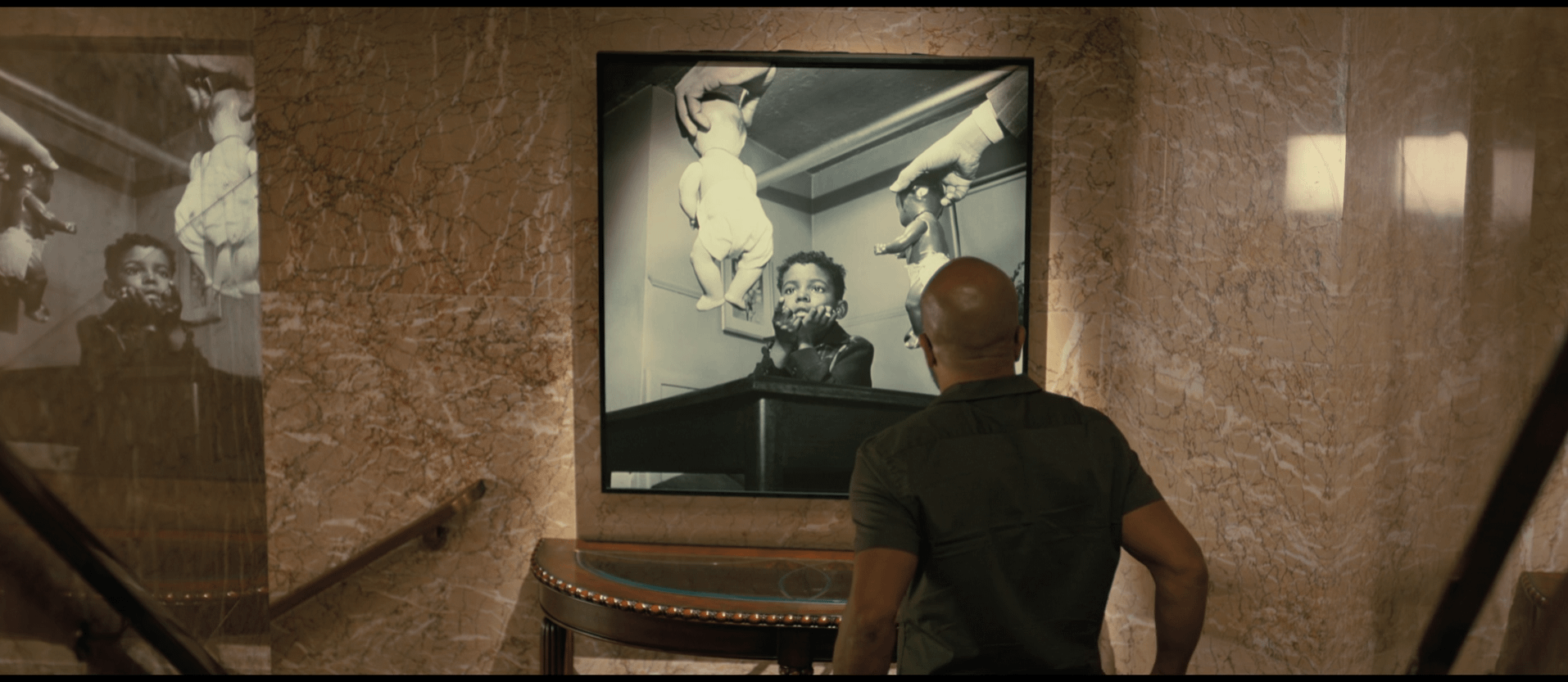 in American Fiction (2023) a picture of "The Doll Test" is shown. A ...