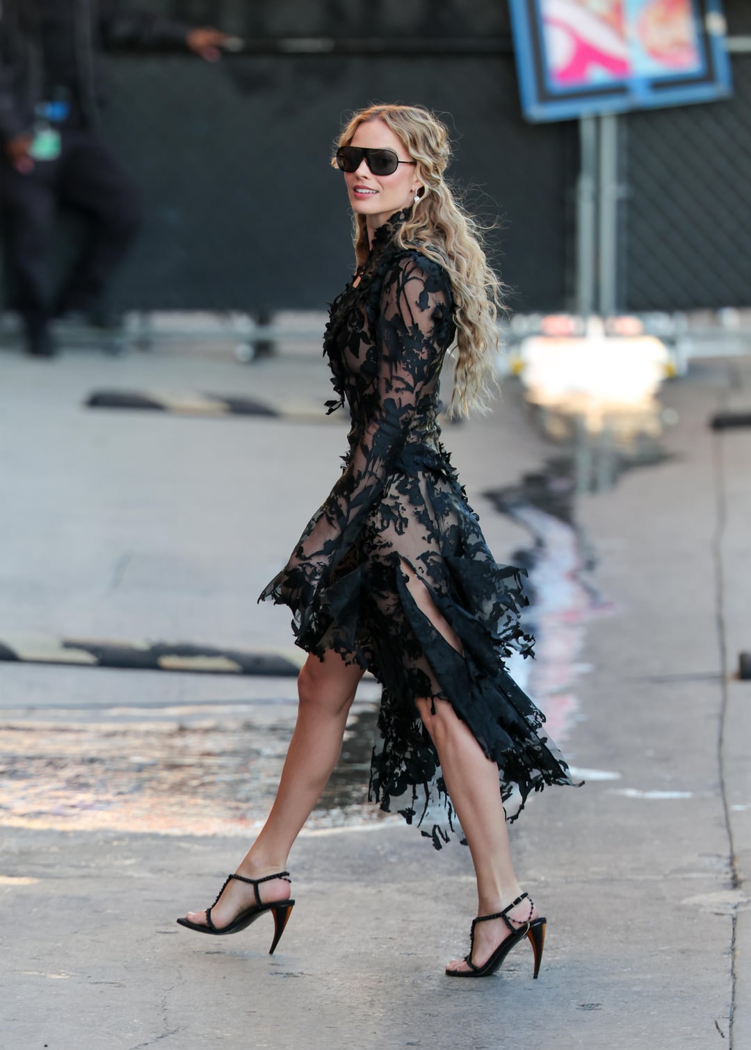 Margot Robbie wearing Alexander McQueen on Jimmy Kimmel Live to promote ...
